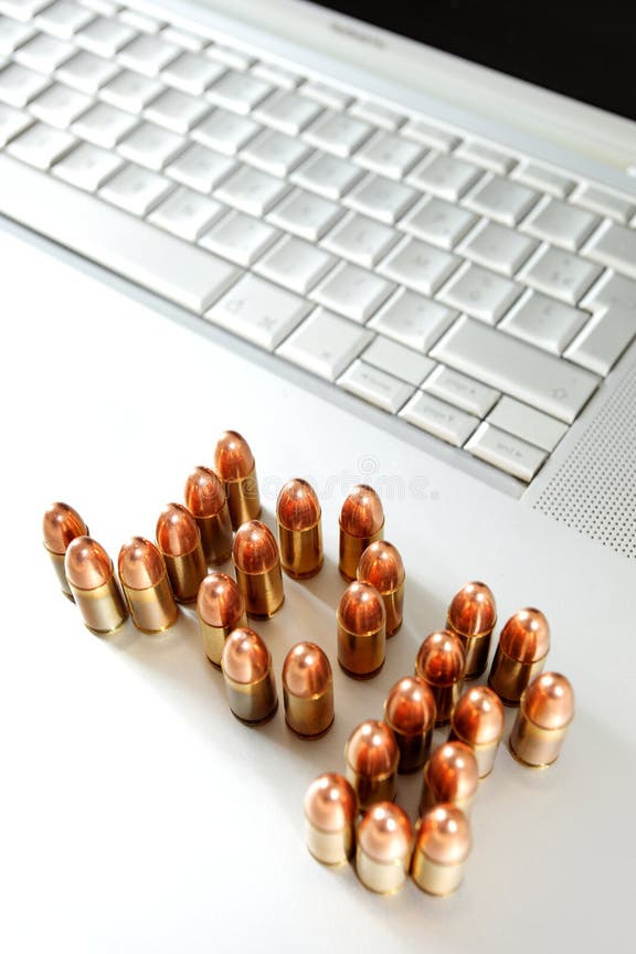 Bullets and lap top editorial photo. Image of round, laptop - 23871276