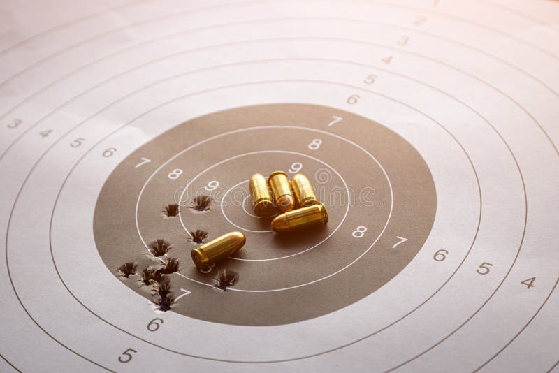 Bullets on Paper Target for Shooting Practice Stock Photo - Image of ...