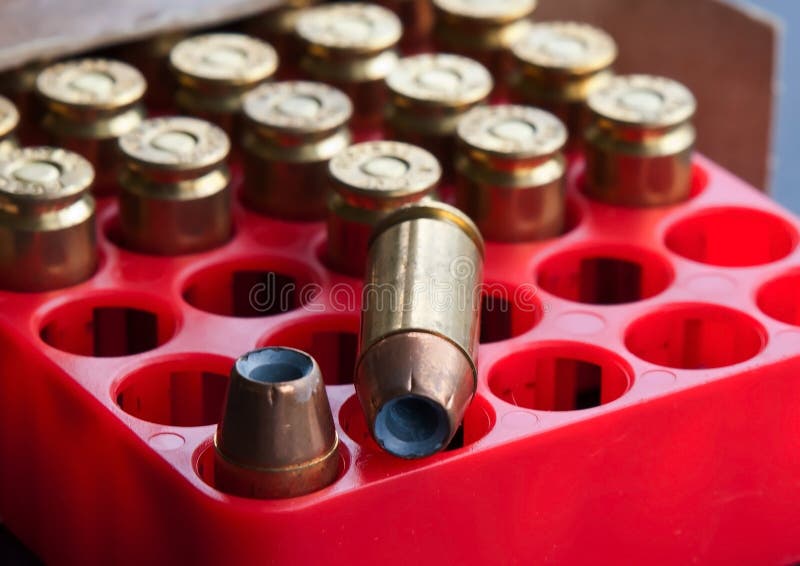 Bullets in a red case stock photo. Image of lead, gold - 121761866