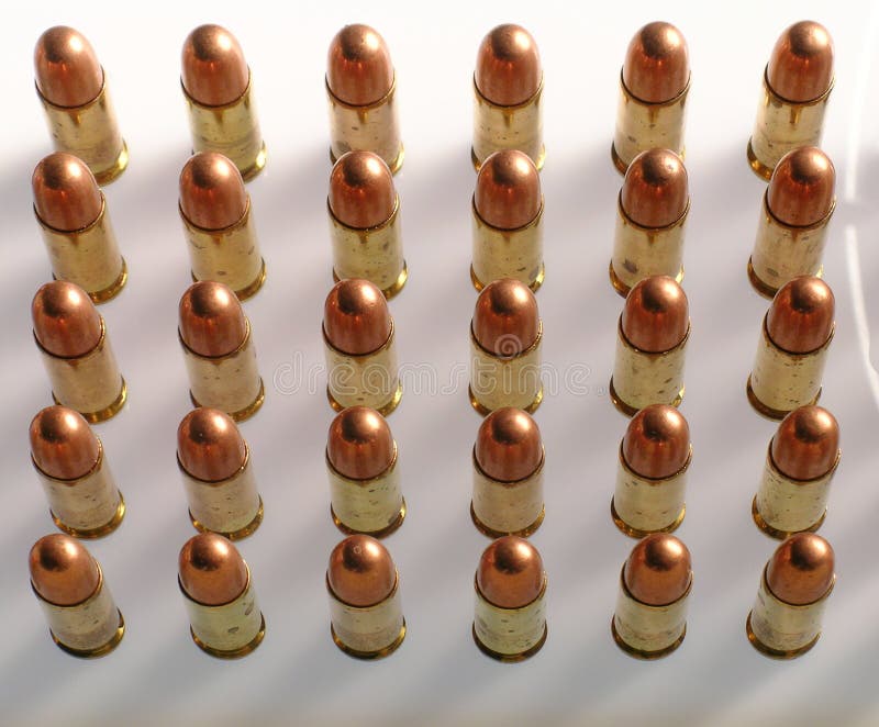 Bullets in a Row stock photo. Image of brass, ammuntion - 47427504