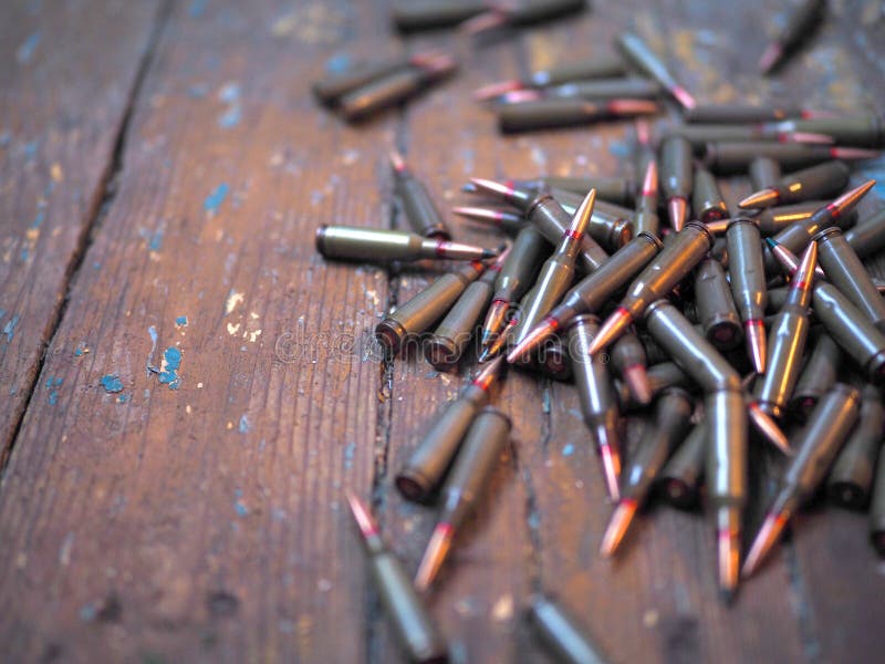 Bullets on a Wooden Surface. War Stock Image - Image of concept ...