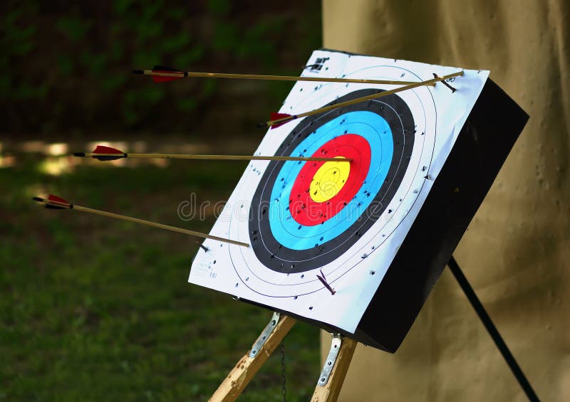 Bullseye with many arrows stock photo. Image of outdoor - 117668362