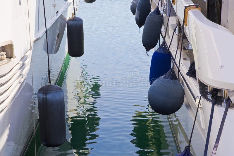 Bumpers Protection between Two Moored Boats in a Small Harbour Stock ...