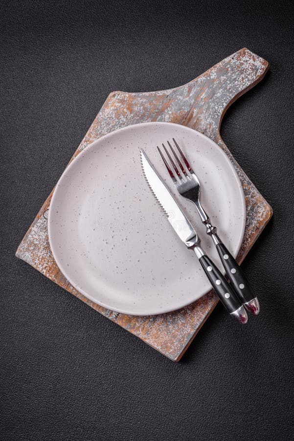 Bumpy Empty Ceramic Plate on a Textured Concrete Background Stock Image ...