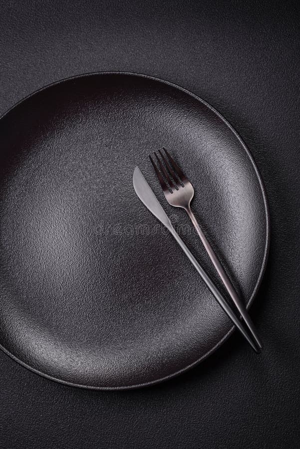 Bumpy Empty Ceramic Plate on a Textured Concrete Background Stock Photo ...