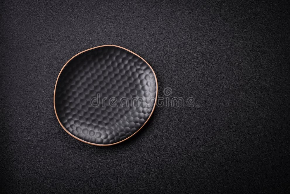 Bumpy Empty Ceramic Plate on a Textured Concrete Background Stock Photo ...
