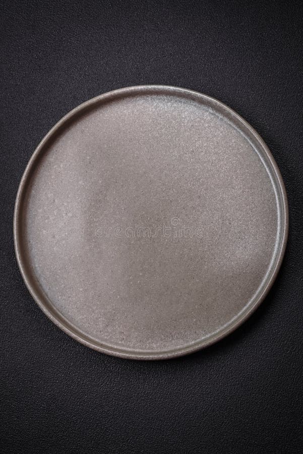 Bumpy Empty Ceramic Plate on a Textured Concrete Background Stock Image ...