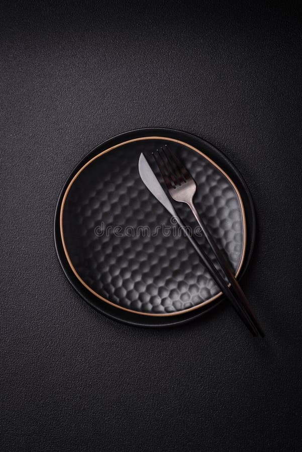 Bumpy Empty Ceramic Plate on a Textured Concrete Background Stock Photo ...