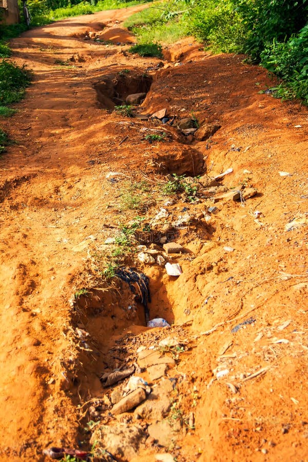 Bumpy Road Heavily Eroded. Walkway with Potholes Stock Photo - Image of ...