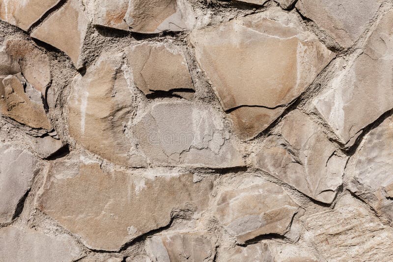 Stone Surface, a Fragment of an Old Wall with Damages and Little Rocks ...