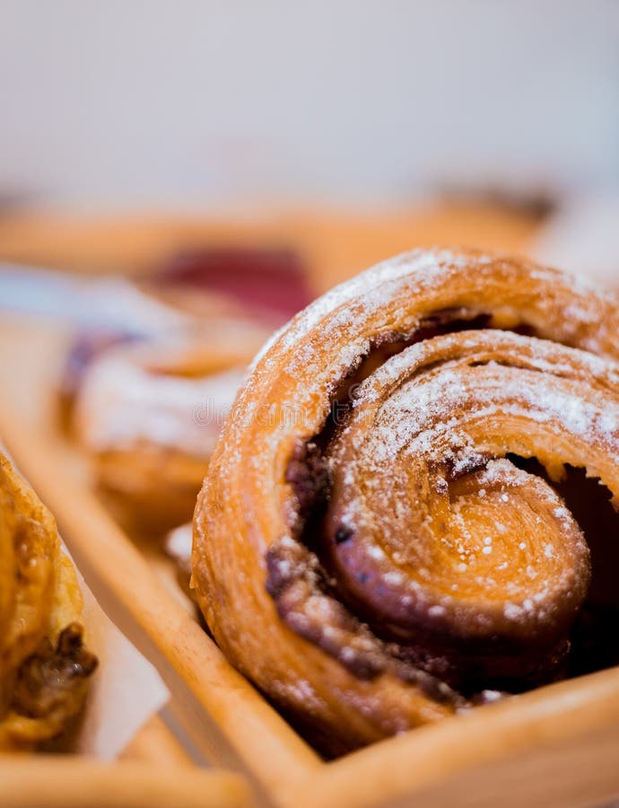Bun with Cinnamon and Nuts Lying on the Wooden Table in Cafe Stock ...