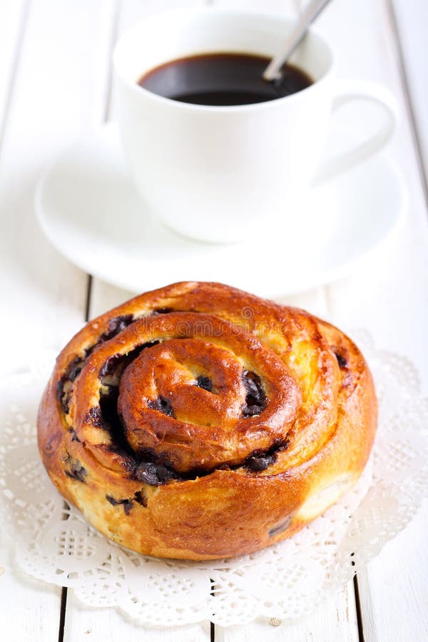 Bun and cup of coffee stock image. Image of drink, plank - 41559555