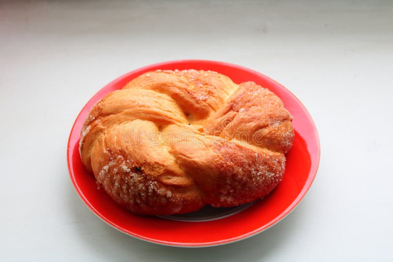 Bun on a Plate on the Table. Stock Image - Image of form, color: 163444855