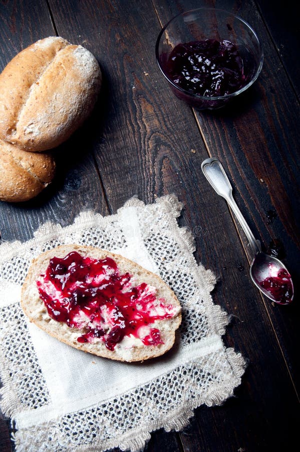 Bun with Sweet Jam for Breakfast Stock Photo - Image of black ...