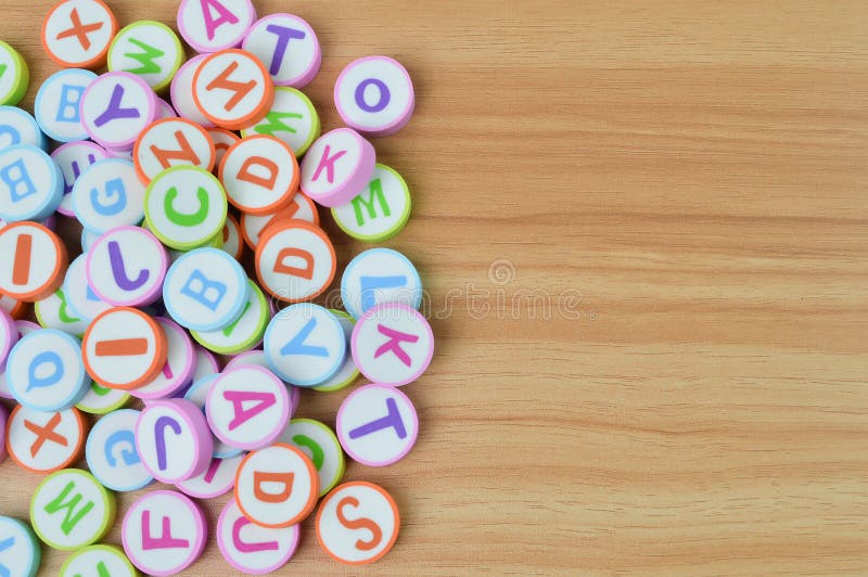 Bunch of Alphabet Letters on Wooden Table with Copy Space Stock Photo ...