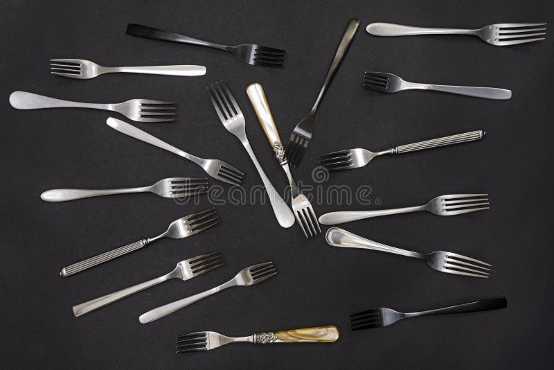 A Bunch of Assorted Forks Lying on a Black Background Stock Image ...