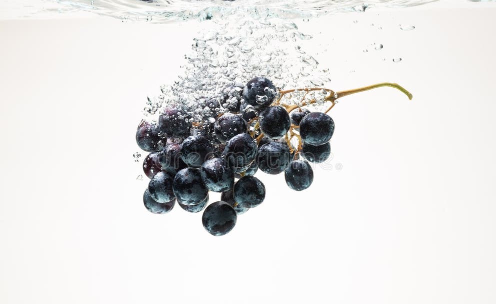Bunch of Blue Grapes Sinking Underwater with Splash. Stock Image ...