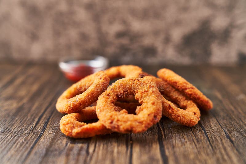 Bunch of Breaded Onion Rings on a Wooden Surface Stock Photo - Image of ...