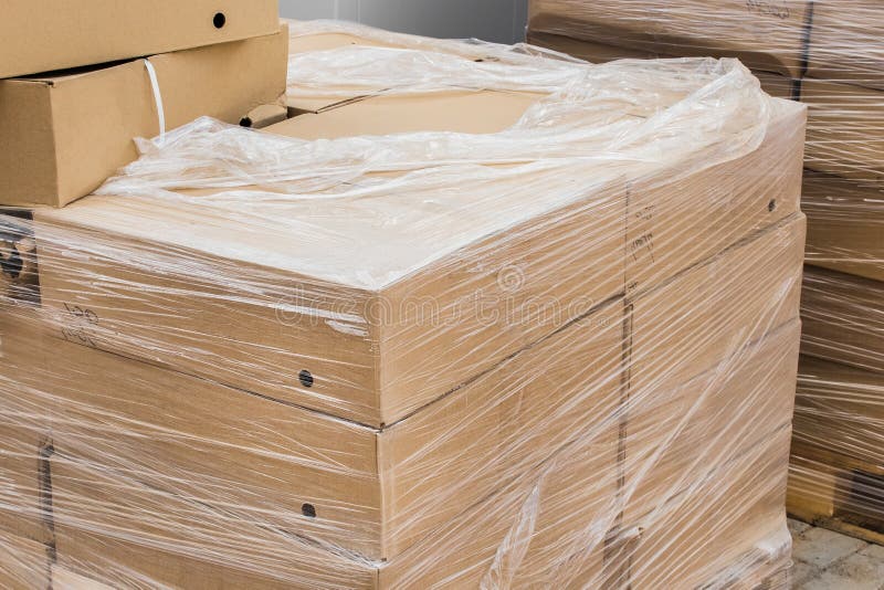 A Bunch of Cardboard Boxes with Building Materials Packed in Plastic ...