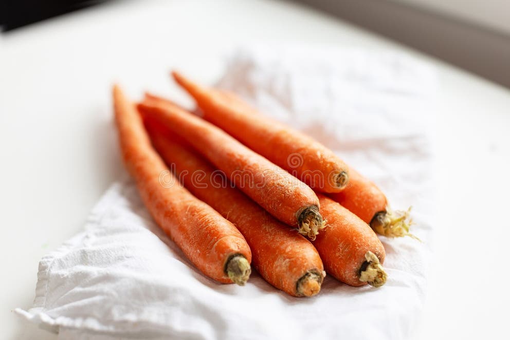 Bunch of Carrots are on a White Cloth Stock Photo - Image of ripe, food ...