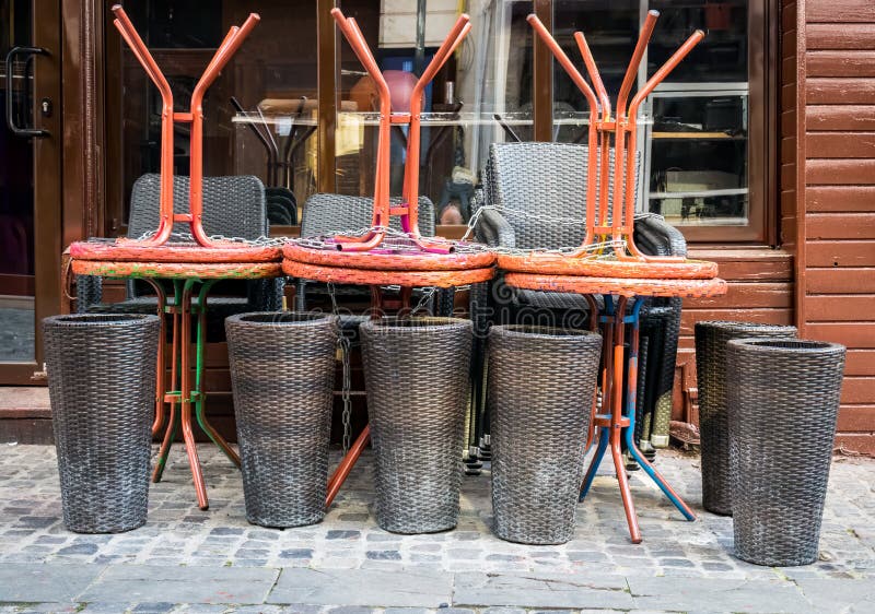 Bunch of Chairs and Tables Stacked. End of Season Outdoor Drinking and ...