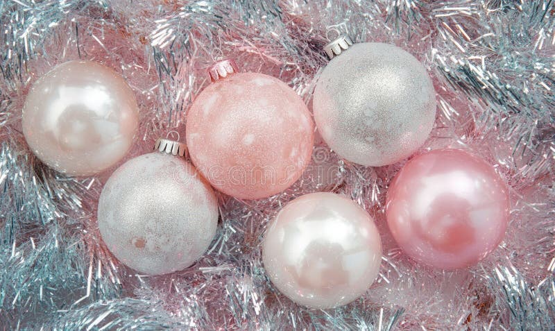 A Bunch of Christmas Ornaments are on a Silver String Stock Photo ...