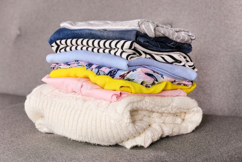 Bunch Of Different Colorful Clothing Items Folded In Stack Stock Photo ...