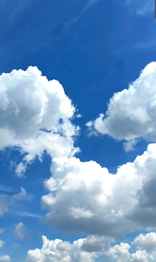 A Bunch of Clouds in the Blue Sky with a Portrait Shape Stock Image ...