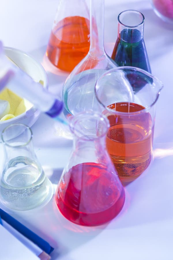 Bunch of Colorful Liquid Chemicals in Flasks Placed in Lab. Stock Image ...