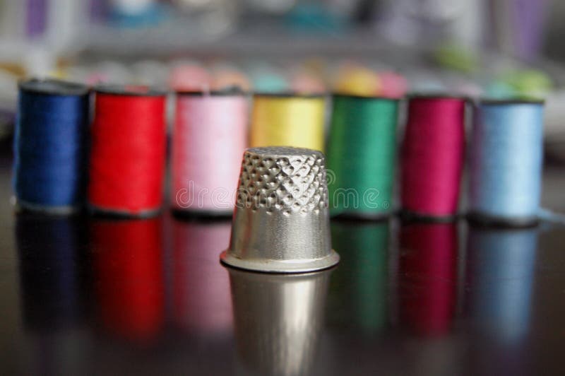 Sewing Thumb Metal Guard with Colorful Spools Stock Photo - Image of ...