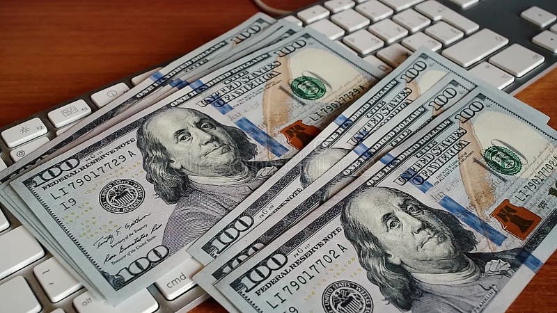 Bunch of Dollar Bill Notes Thrown on a White Keyboard Featured ...