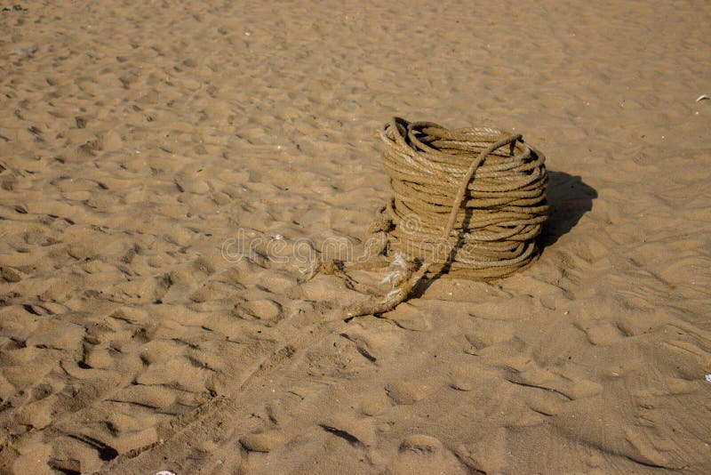 Bunch of Fishing Rope on Beach Sand - Using Fishing Rope Stock Photo ...