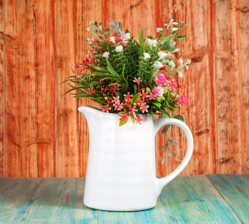 Bunch of Flowers in a Jug on Old Wooden Stock Image - Image of herbs ...