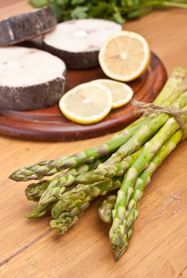 Bunch of Fresh Asparagus and Raw Fish Stock Photo - Image of garnished ...