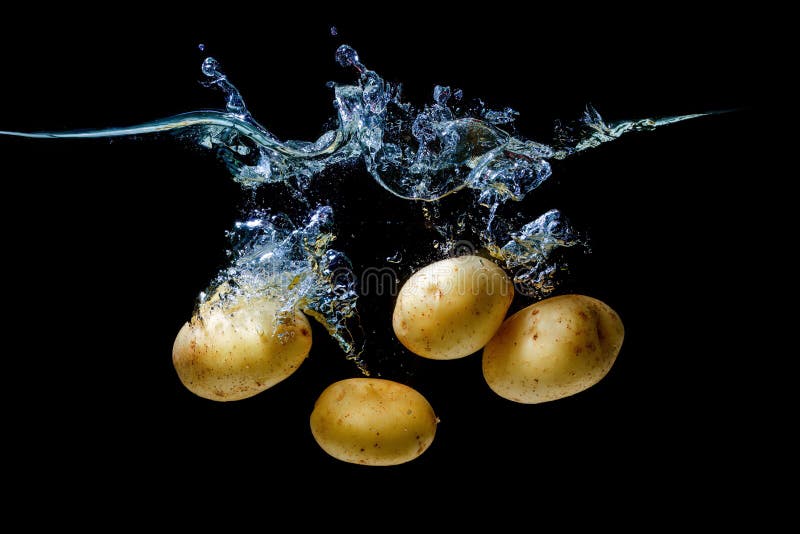 Fresh Potatoes Falling in Water with Splashes Stock Photo - Image of ...