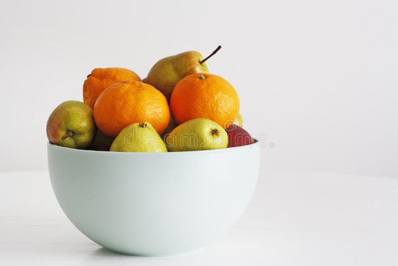 A Bunch of Fruit in a Bowl. Apples, Pears, Oranges. Stock Photo - Image ...