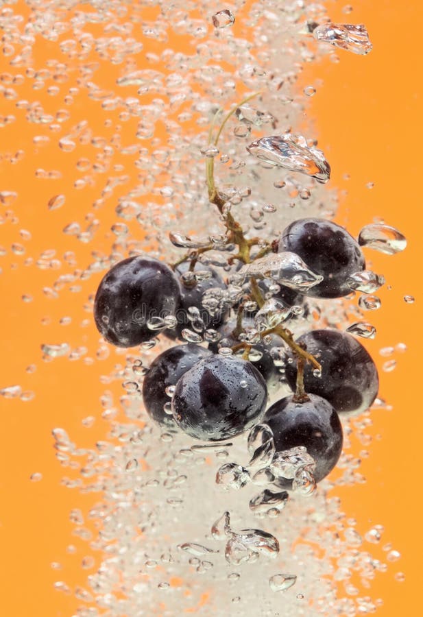Bunch of Grapes Floating in Water with Air Bubbles Stock Image - Image ...