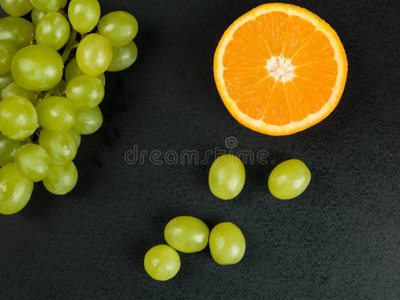 Bunch of Grapes with an Orange Stock Photo - Image of minimalistic ...