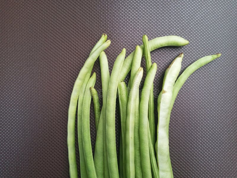 Bunch of Green Beans on Textured Brown Surface Stock Image - Image of ...