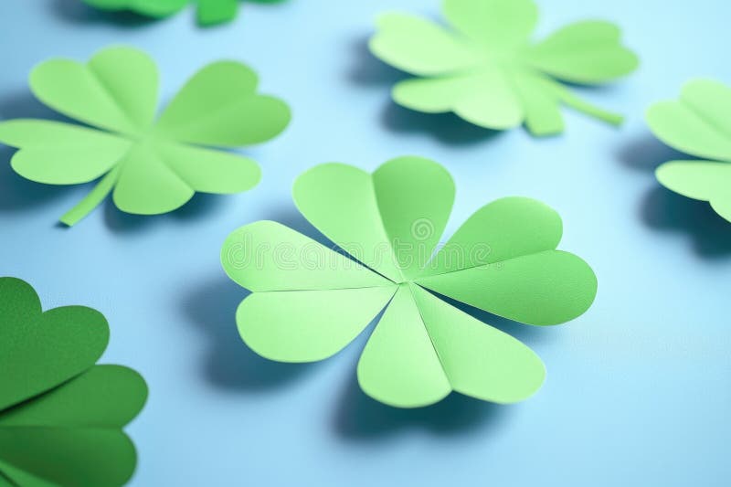 Bunch of Green Paper Clovers are on a Blue Background Stock ...