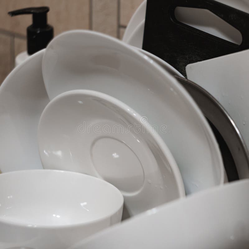 Bunch of Just Washed Dishes Piled upon a Drier Stock Image - Image of ...