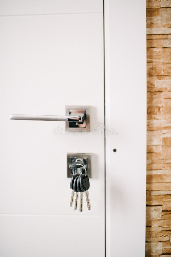 A Bunch of Keys in the Door Lock. Key in the Keyhole Close-up Stock ...
