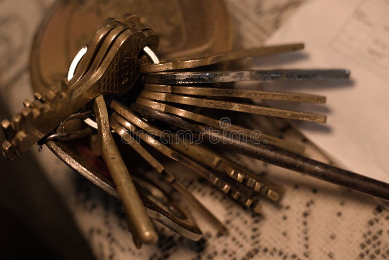 Bunch of Keys with Lock on a White Surface. Close Up. Stock Image ...