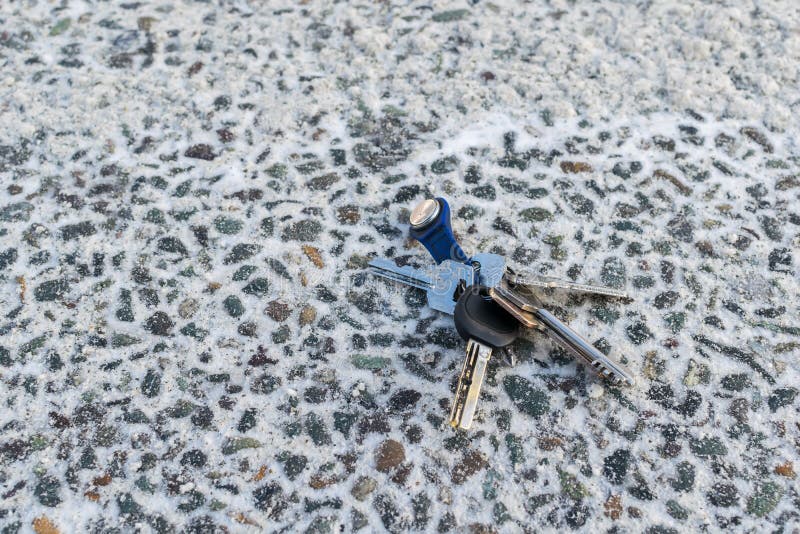 A Bunch of Keys Lying on the Asphalt Road in Winter Stock Image - Image ...