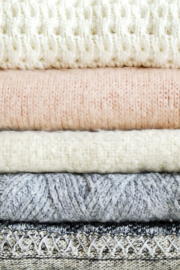 Minimalistic Rustic Composition with Stacked Vintage Knitted Sweaters ...