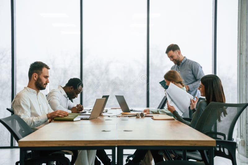 Bunch of Laptops on the Table. Team of Office Workers are Together ...