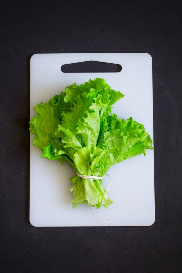 Bunch of Lettuce on a Cutting Board, Top View Stock Photo - Image of ...