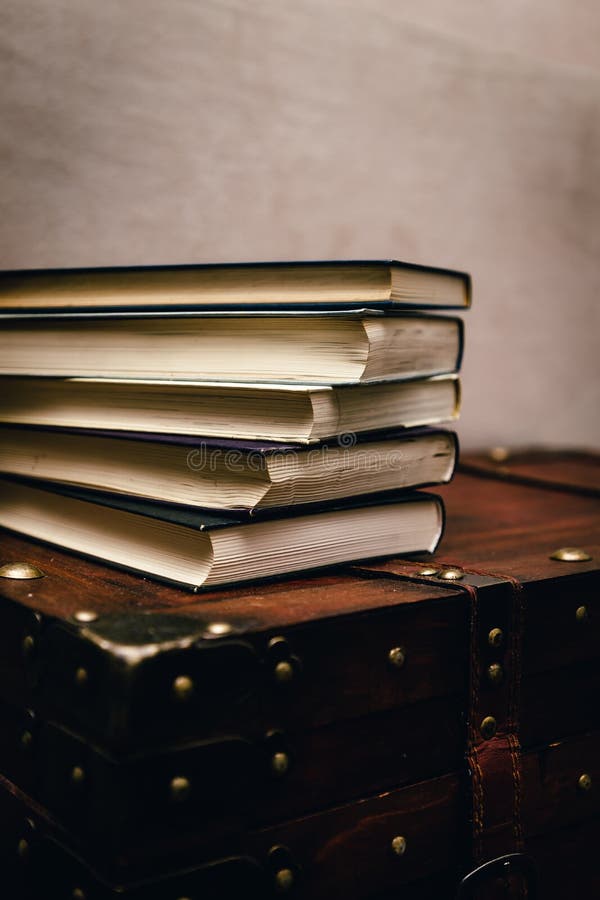 A Bunch of Old, Dirty Books on a Wooden Chest Stock Photo - Image of ...