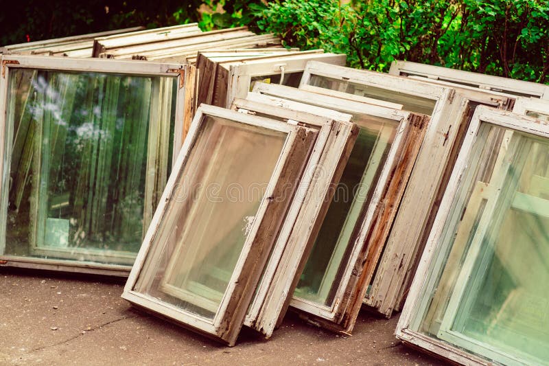 Bunch of Old Wooden Windows Frames on the Street. Replacement of ...
