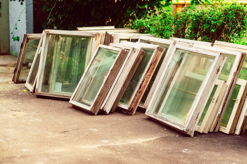 Bunch of Old Wooden Windows Frames on the Street. Replacement of ...